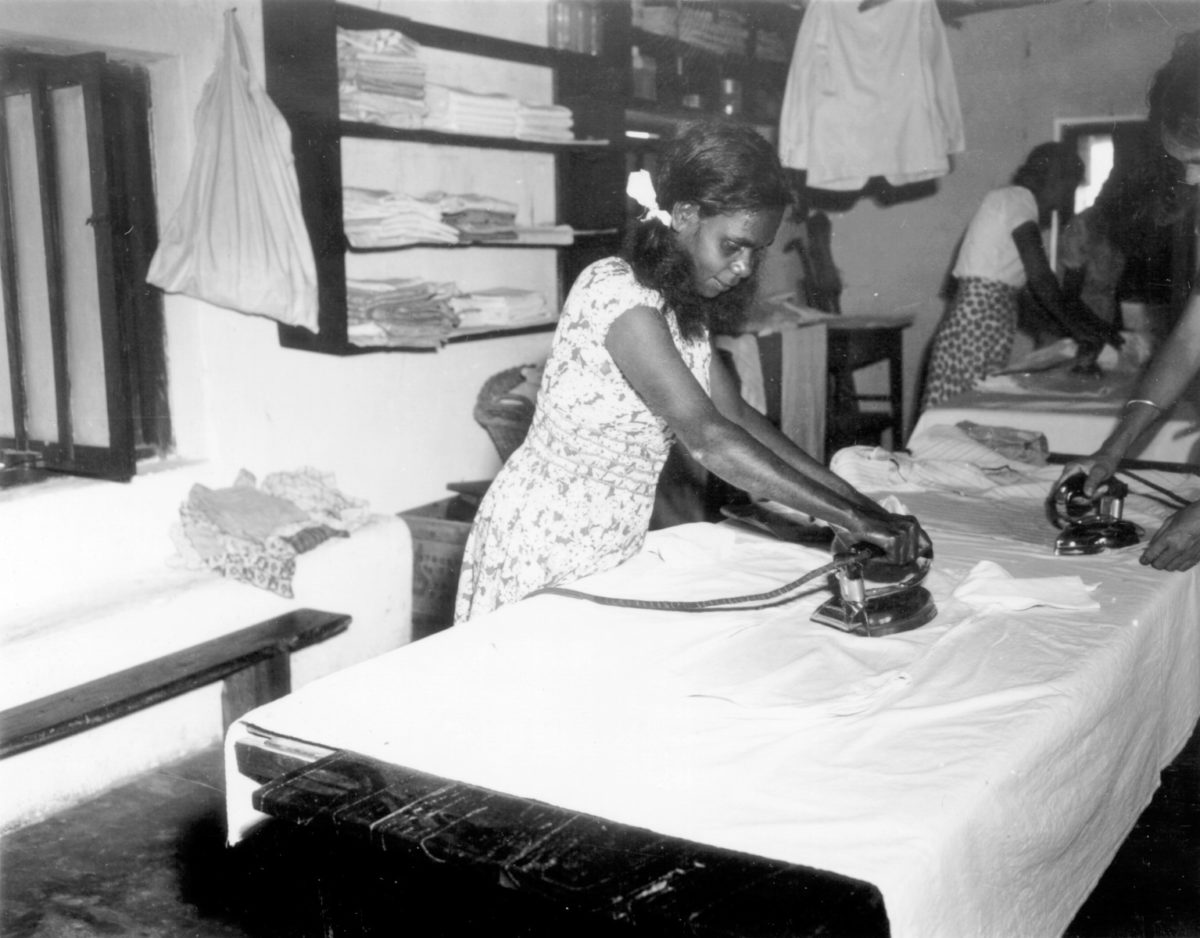 Girl ironing,1953 | Find and Connect